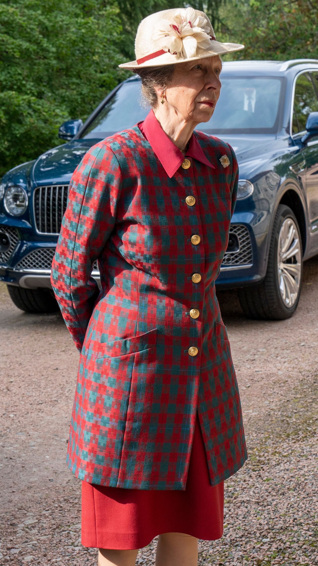 Princess Anne’s cranberry red dress and gold-buttoned coat | Woman & Home