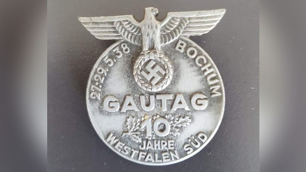 History teacher finds secret cache of Nazi artifacts hidden behind ...