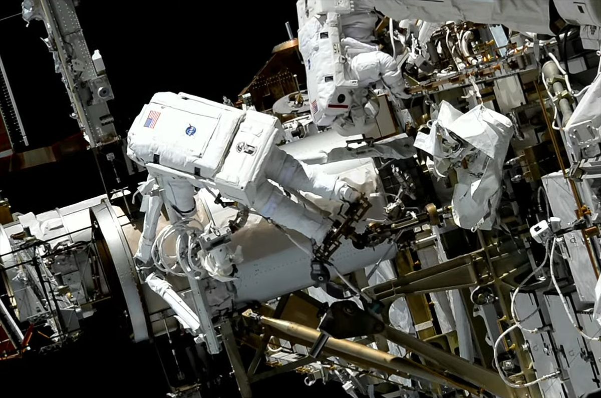 Spacewalking astronauts hit snags installing solar array mount on ISS ...