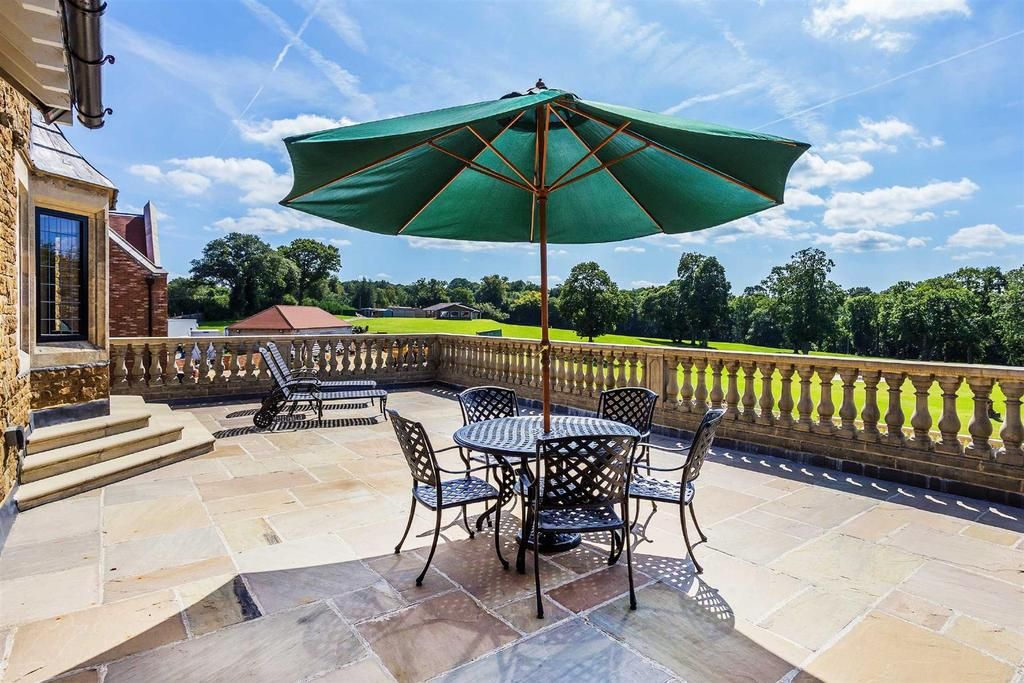 An extravagant Surrey mansion with a helipad, an American diner and a ...