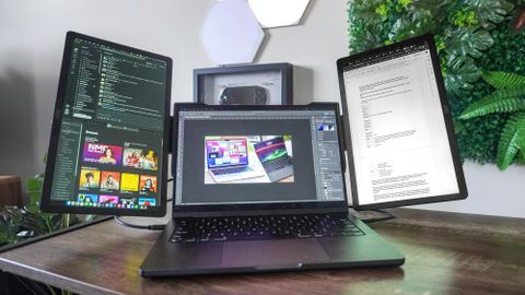 This tri-screen portable monitor setup has revolutionized my ...