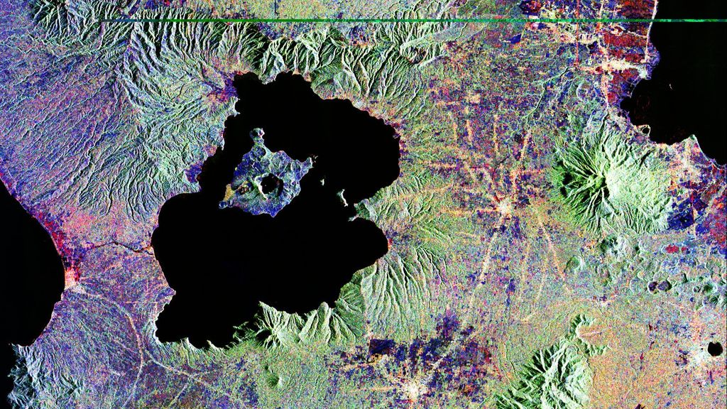 Taal Lake: The volcanic crater that has 'an island within a lake ...