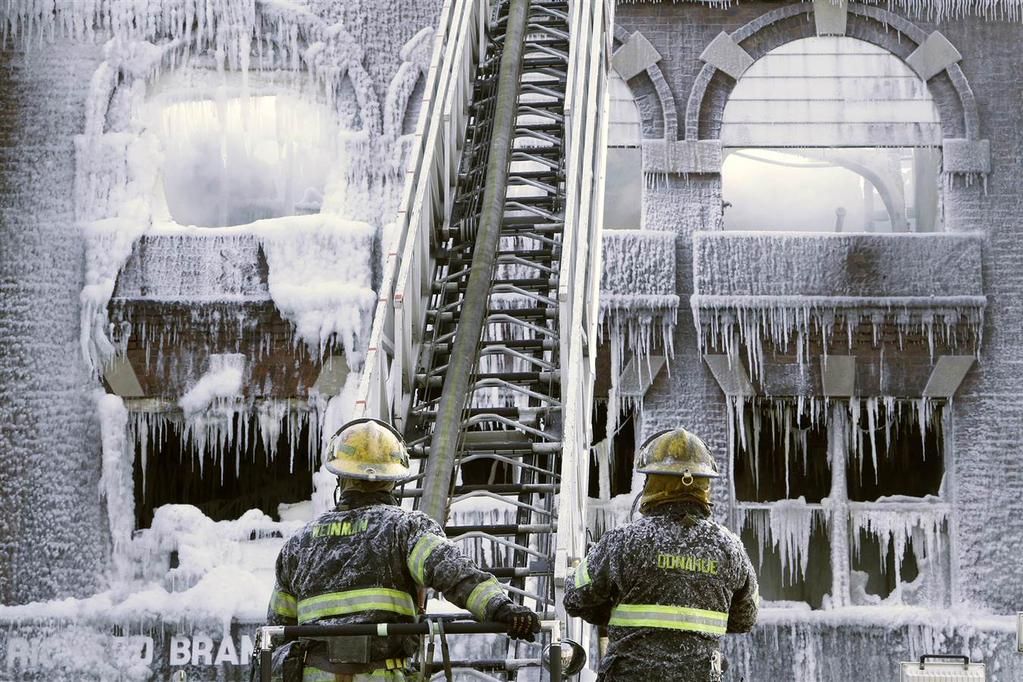 Firefighters watch as building on fire turns into ice palace | The Week
