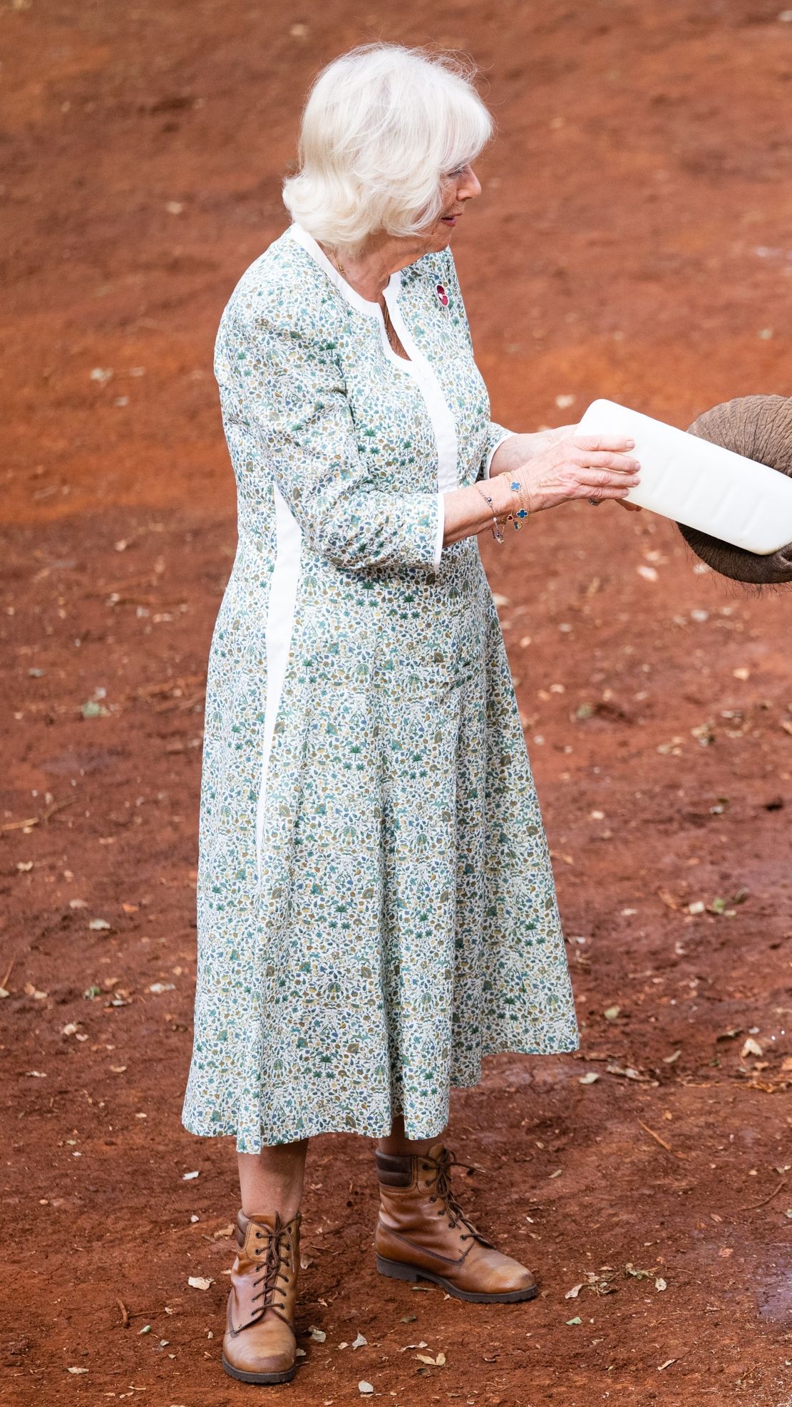 Queen Camilla's old-school boots are smash hit as she nails outdoor ...