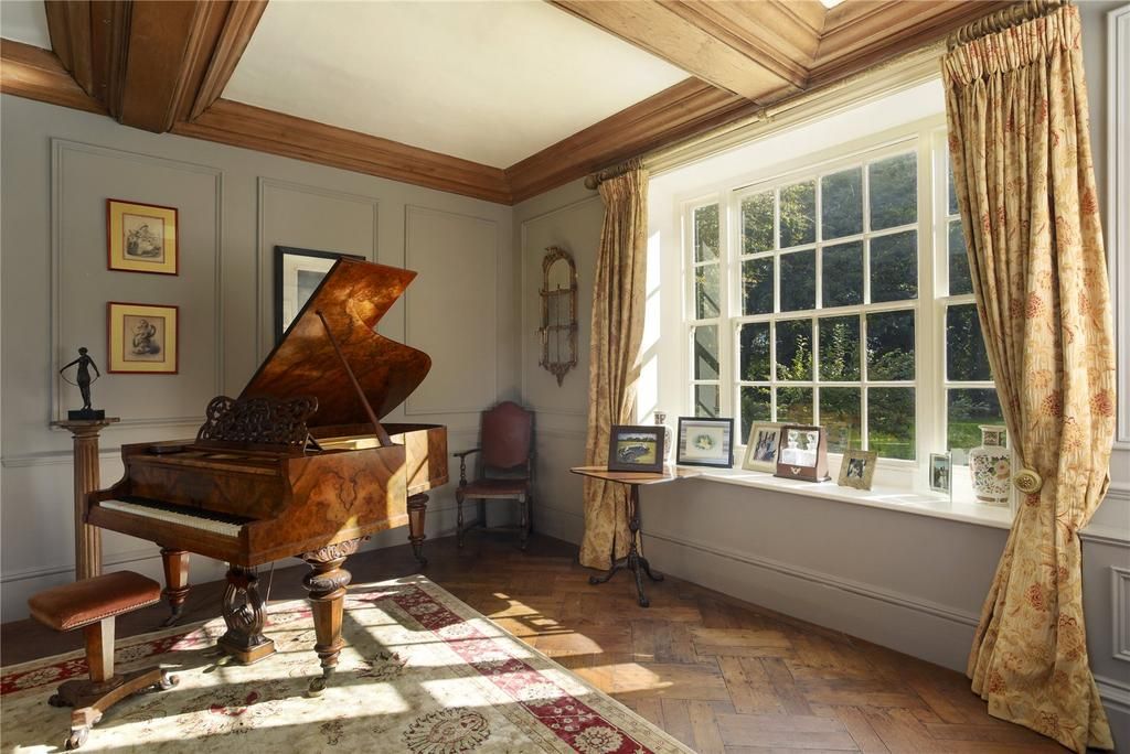 The Kent manor with an original Tudor fireplace and space for a string ...