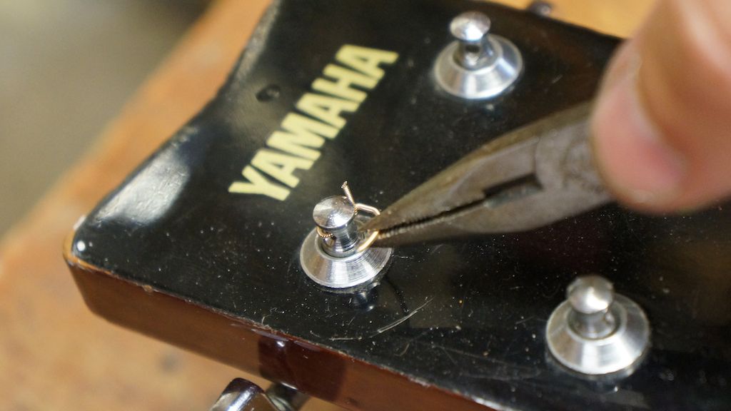 How to restring an acoustic guitar: step-by-step guidance from a ...