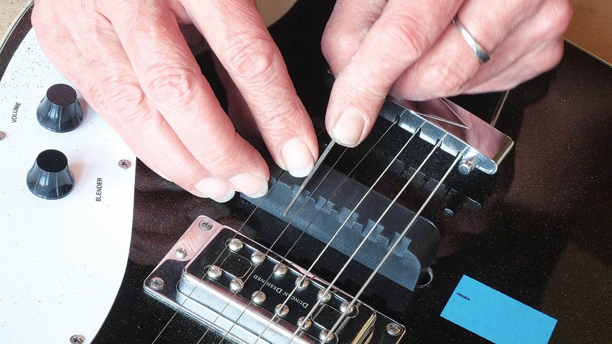 How to install a rubber bridge on an electric guitar | Guitar World