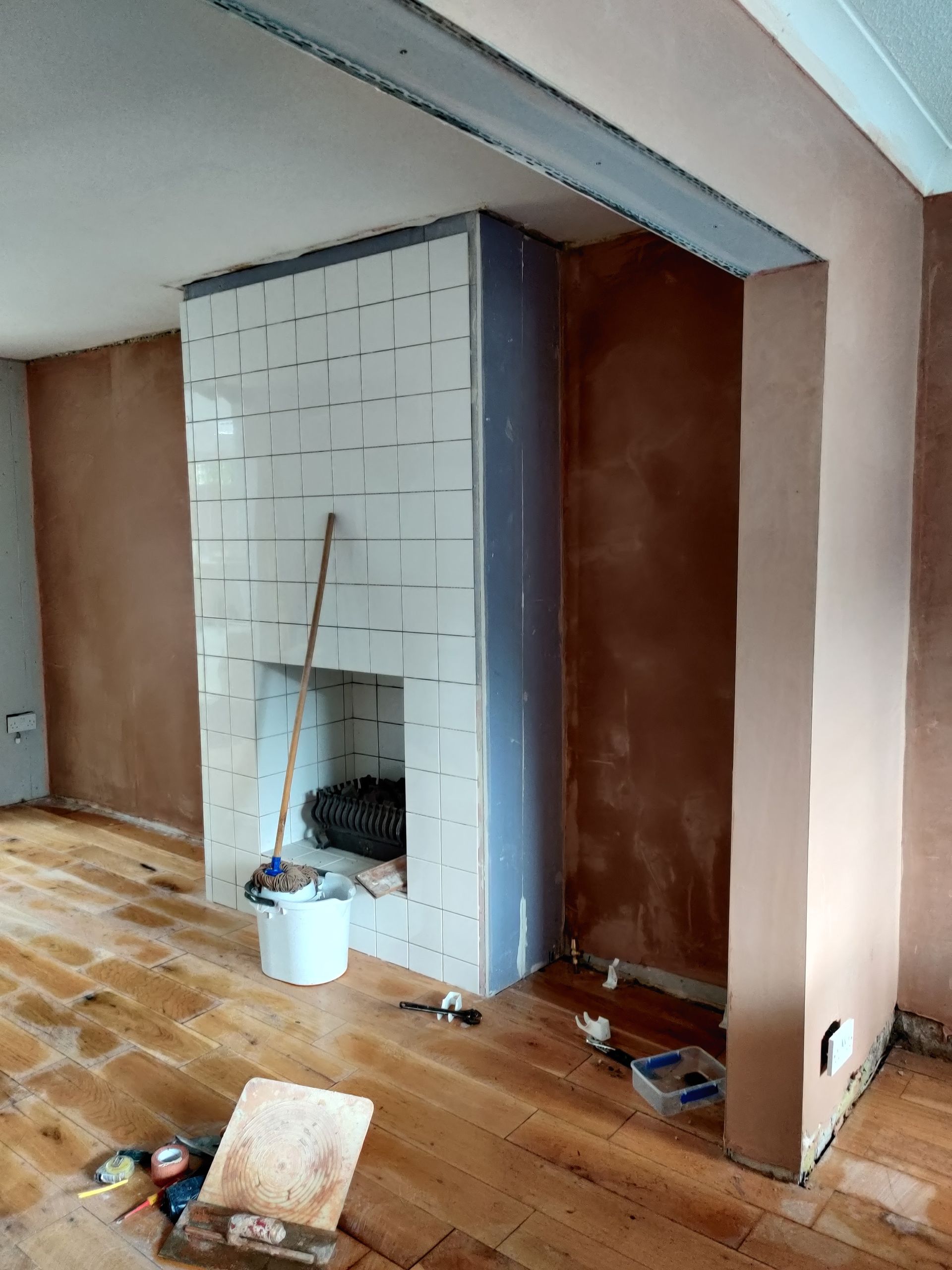 How to tile over a brick fireplace – A DIY expert's top tips | Real Homes