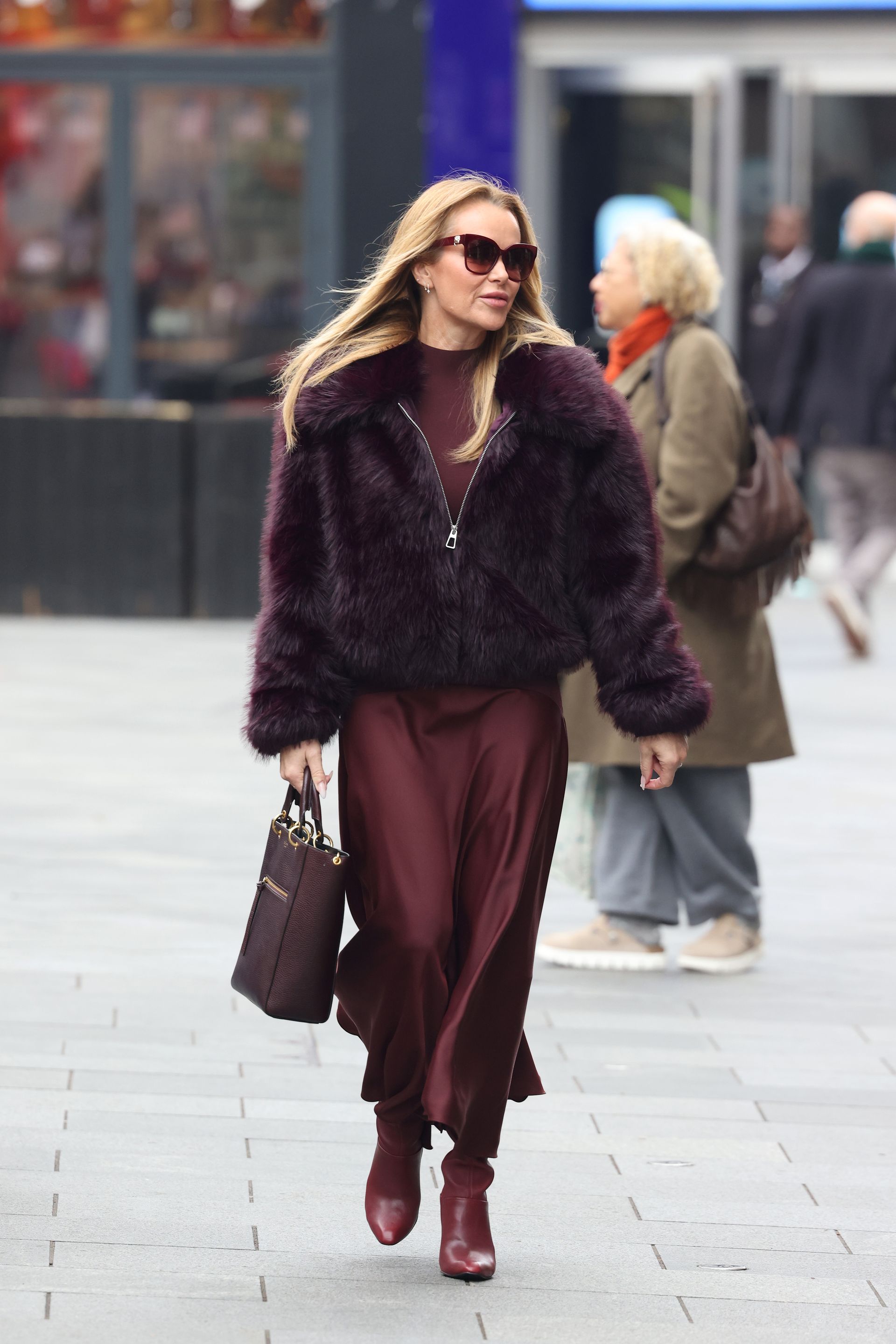 Amanda Holden is a vision in satin, faux fur and leather as she nails ...