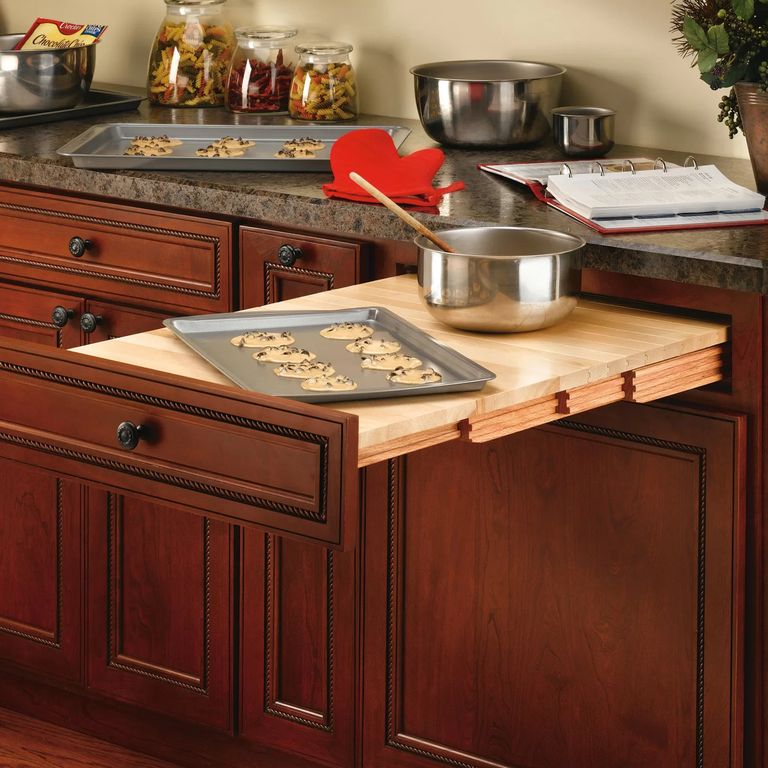 A pull-out countertop is among this small kitchen's cleverest ideas ...