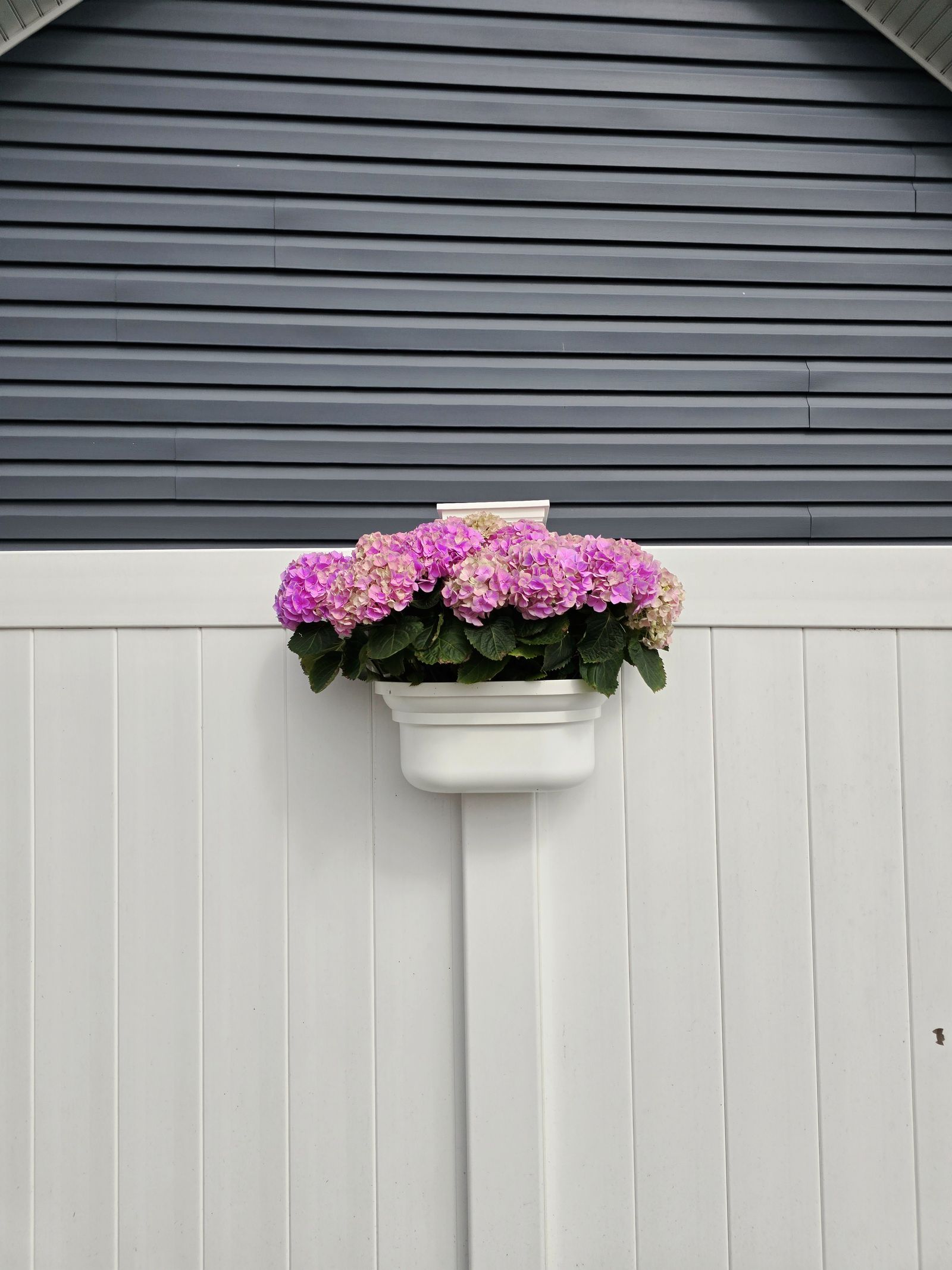 This "Fence Pot" Planter is Adds Pretty Blooms to PVC Fences | Livingetc
