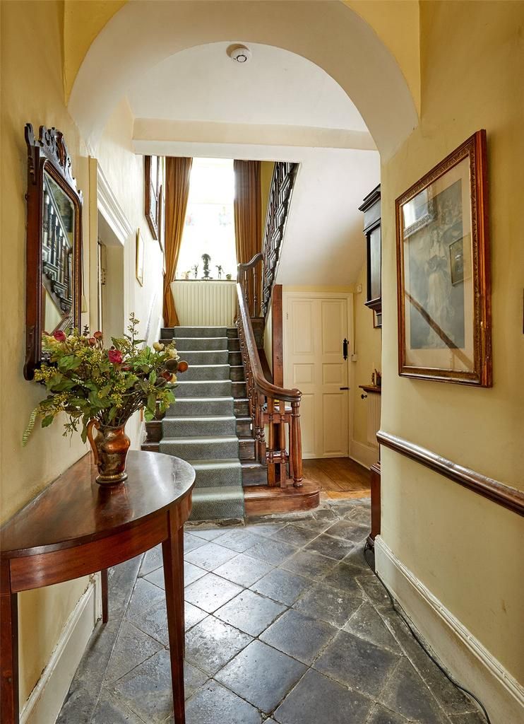 A politely symmetrical 18th century Cotswolds house, owned by the same ...
