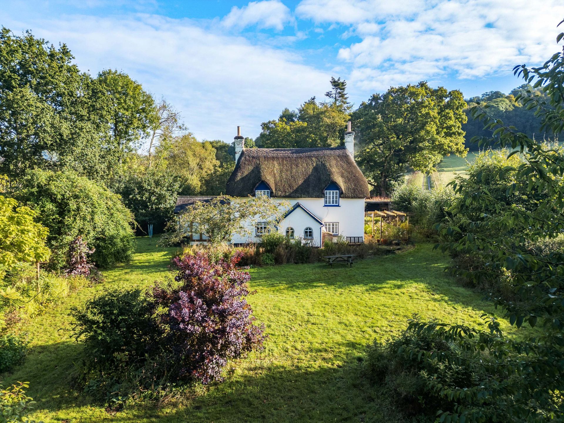 An absurdly perfect thatched country cottage, surrounded by a 6,000 ...