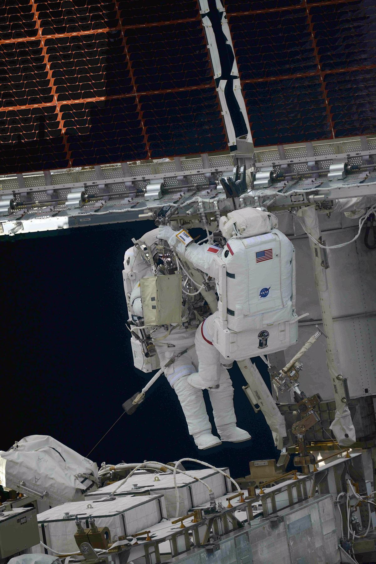 Astronauts On Spacewalk Deploy First Roll Out Solar Array To Boost