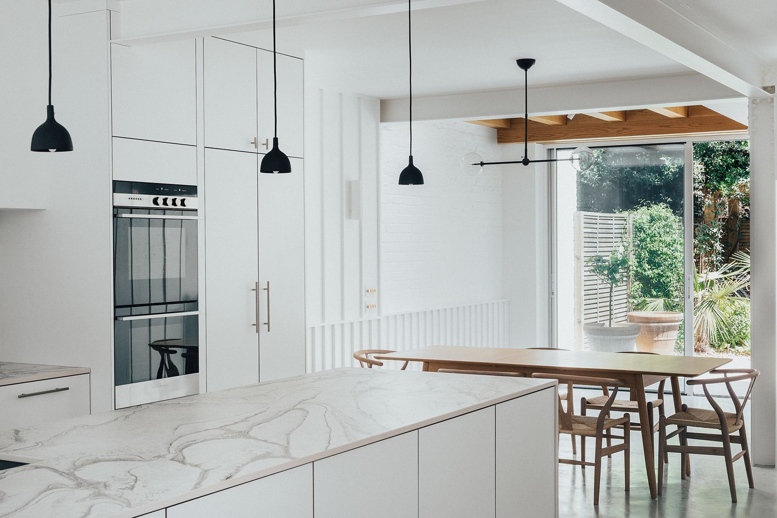 This warm minimalist kitchen is a masterclass in adding soul to white ...