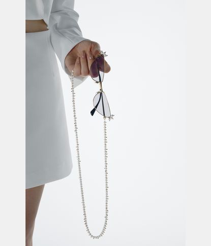 Tasaki marks 70 years with pearl embellished trainers, earphones and ...