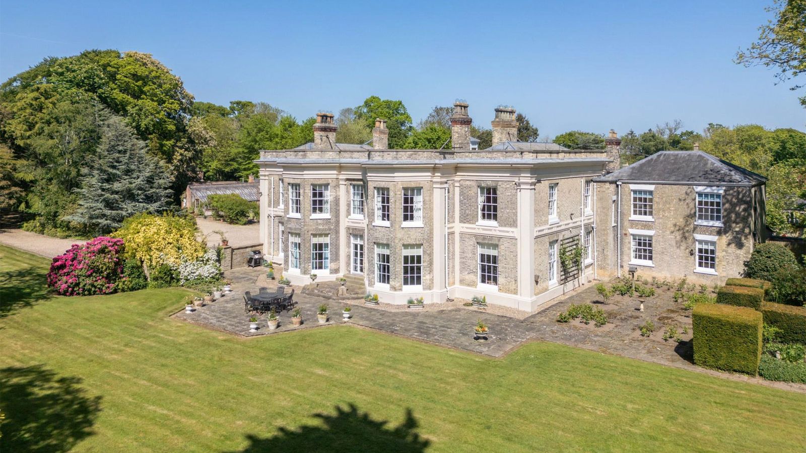 A grand country house tucked away within exquisite gardens, four miles ...