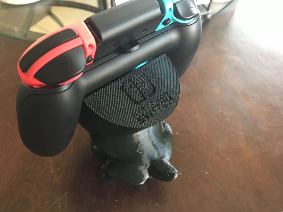 The Nintendo Switch dog is real and it can hold your Joy-Con grip ...