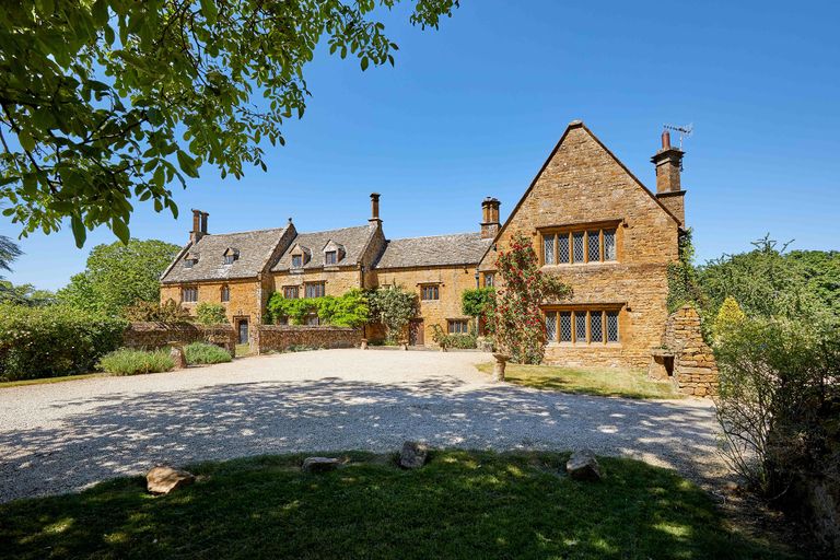 A Cotswolds manor house that boasts a pool, tennis court and six ...
