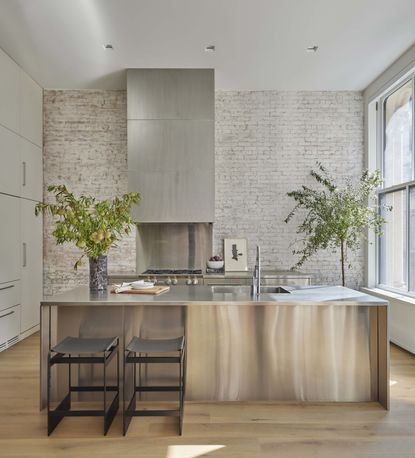 10 waterfall countertop kitchen ideas from top designers | Livingetc