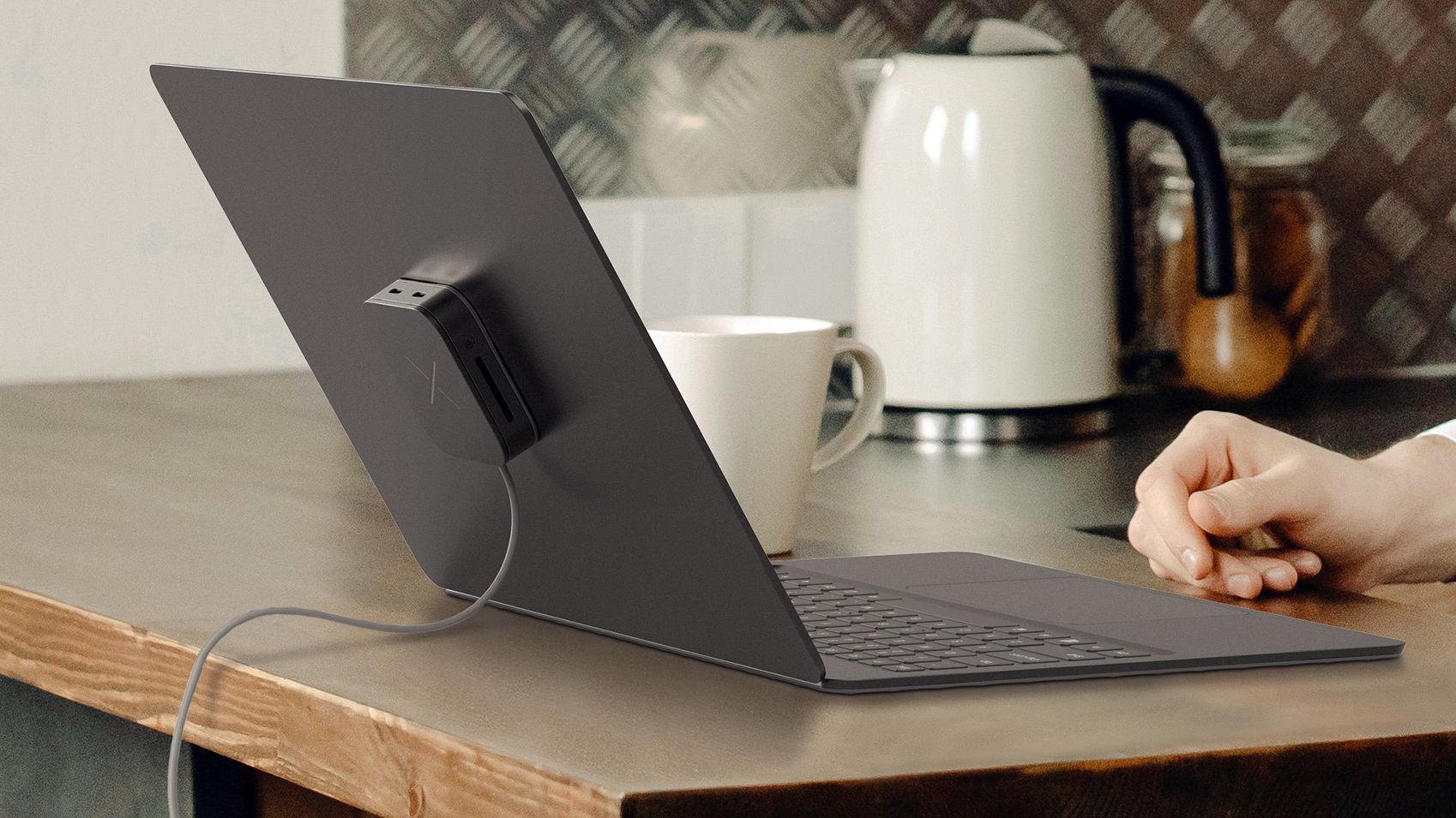 This wild new laptop has absolutely zero ports — and it's thinner than ...