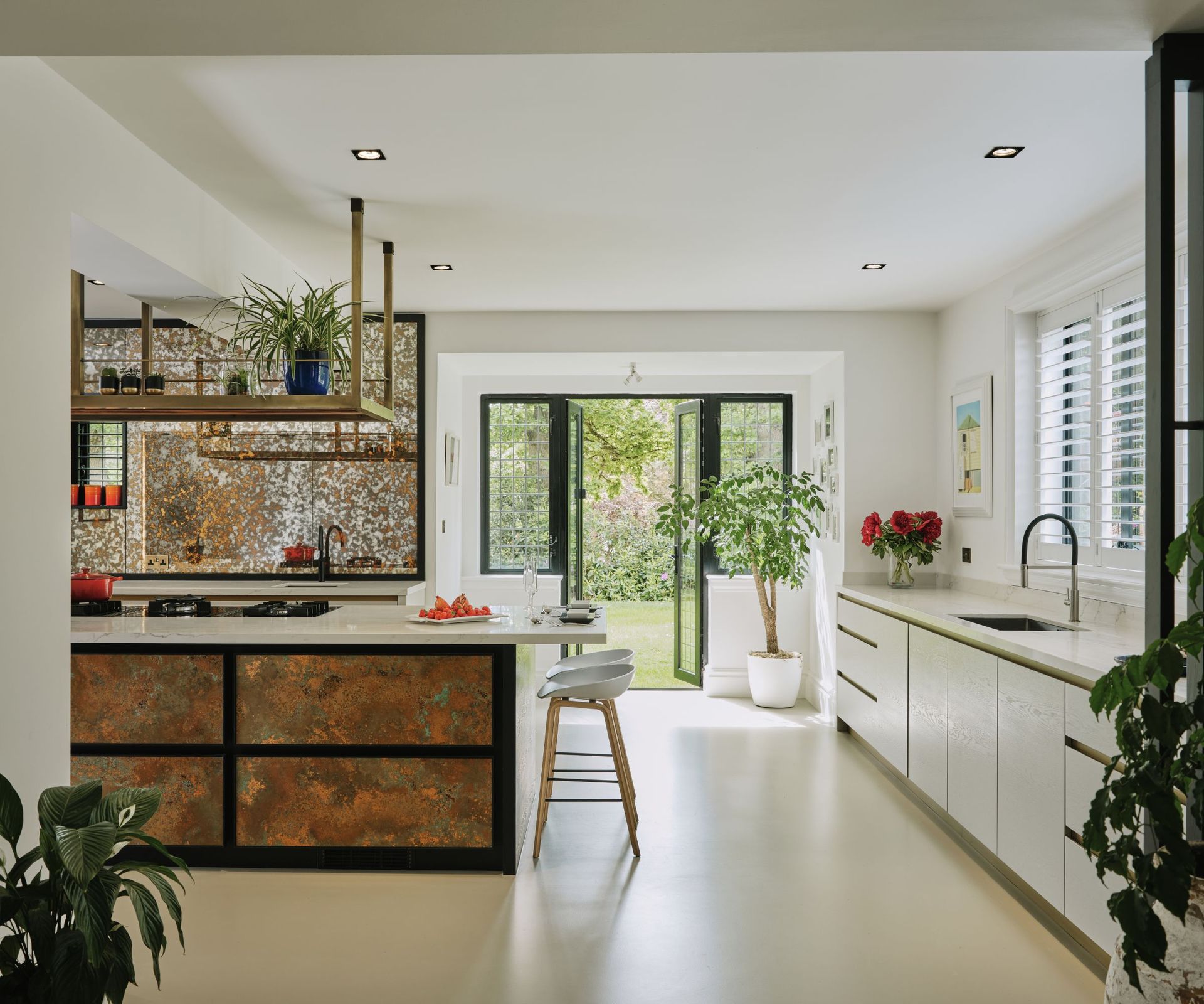 5 spaces proving the metallic kitchen trend is back for 2025 | Homes ...