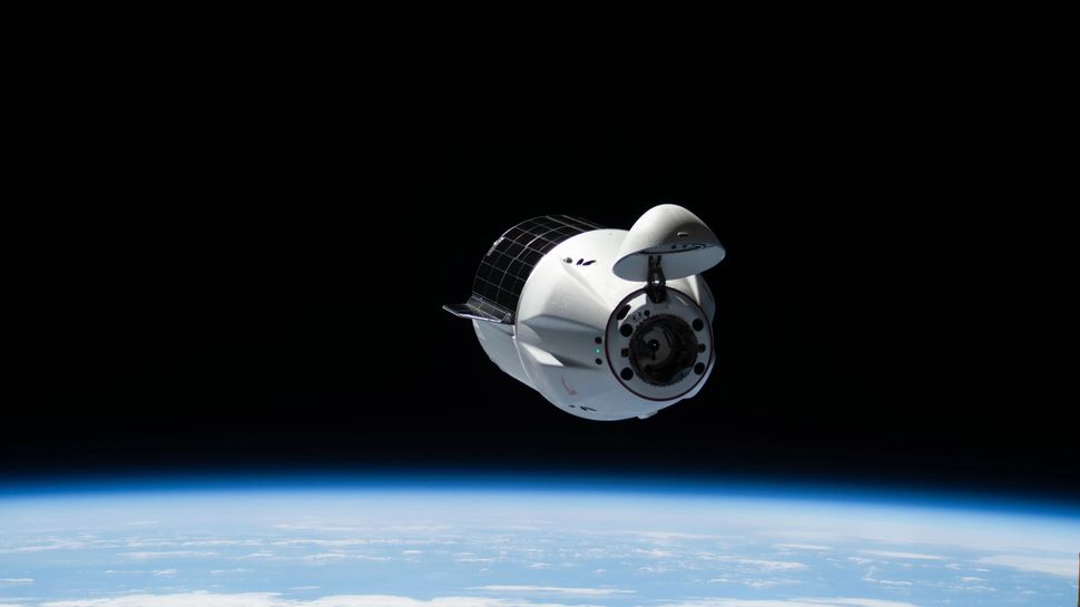 SpaceX Dragon cargo capsule boosts ISS higher above Earth in key test ...