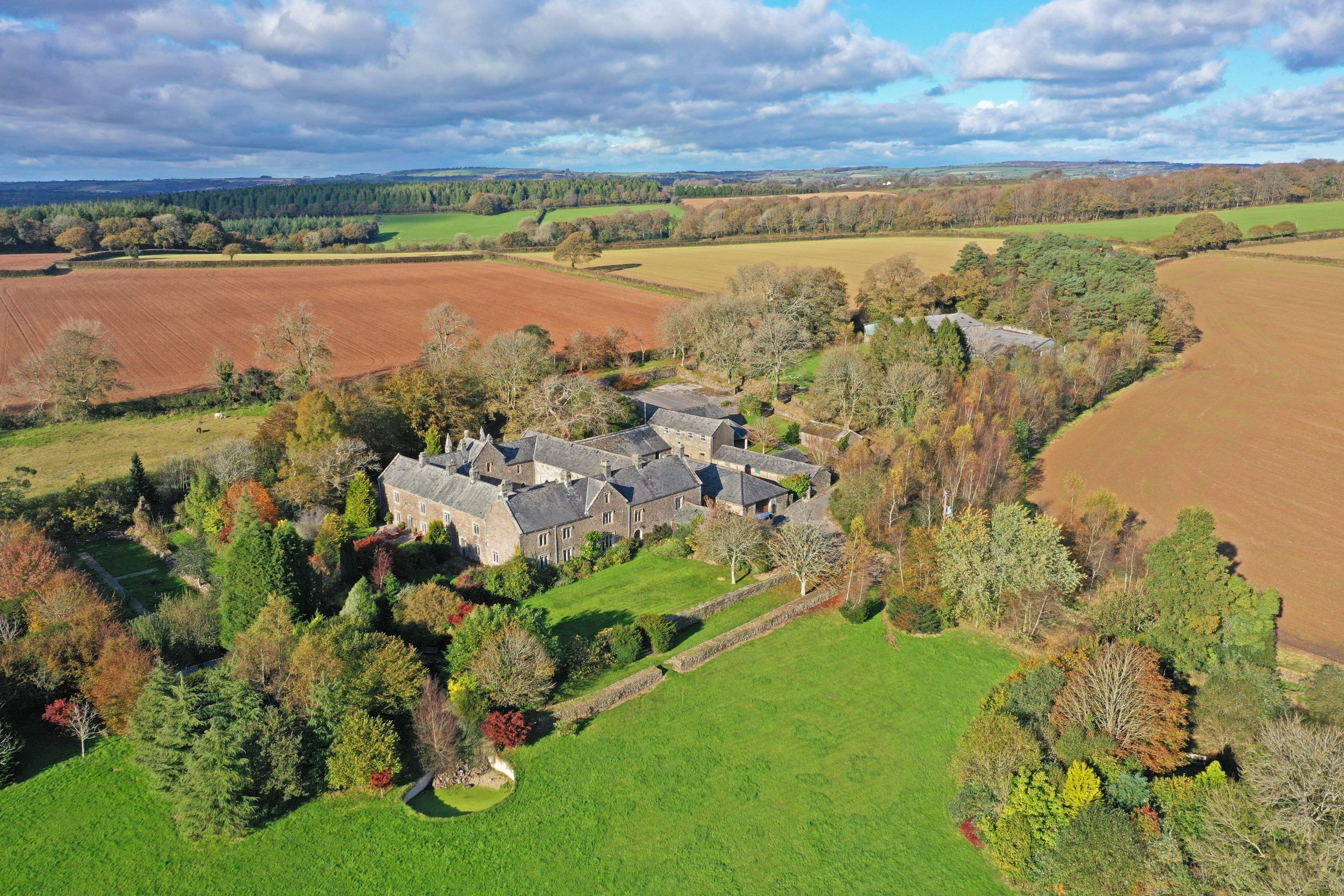 A medieval stone Manor House on the Dartmoor National Park in Devon ...