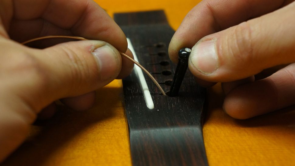 How to restring an acoustic guitar: step-by-step guidance from a ...