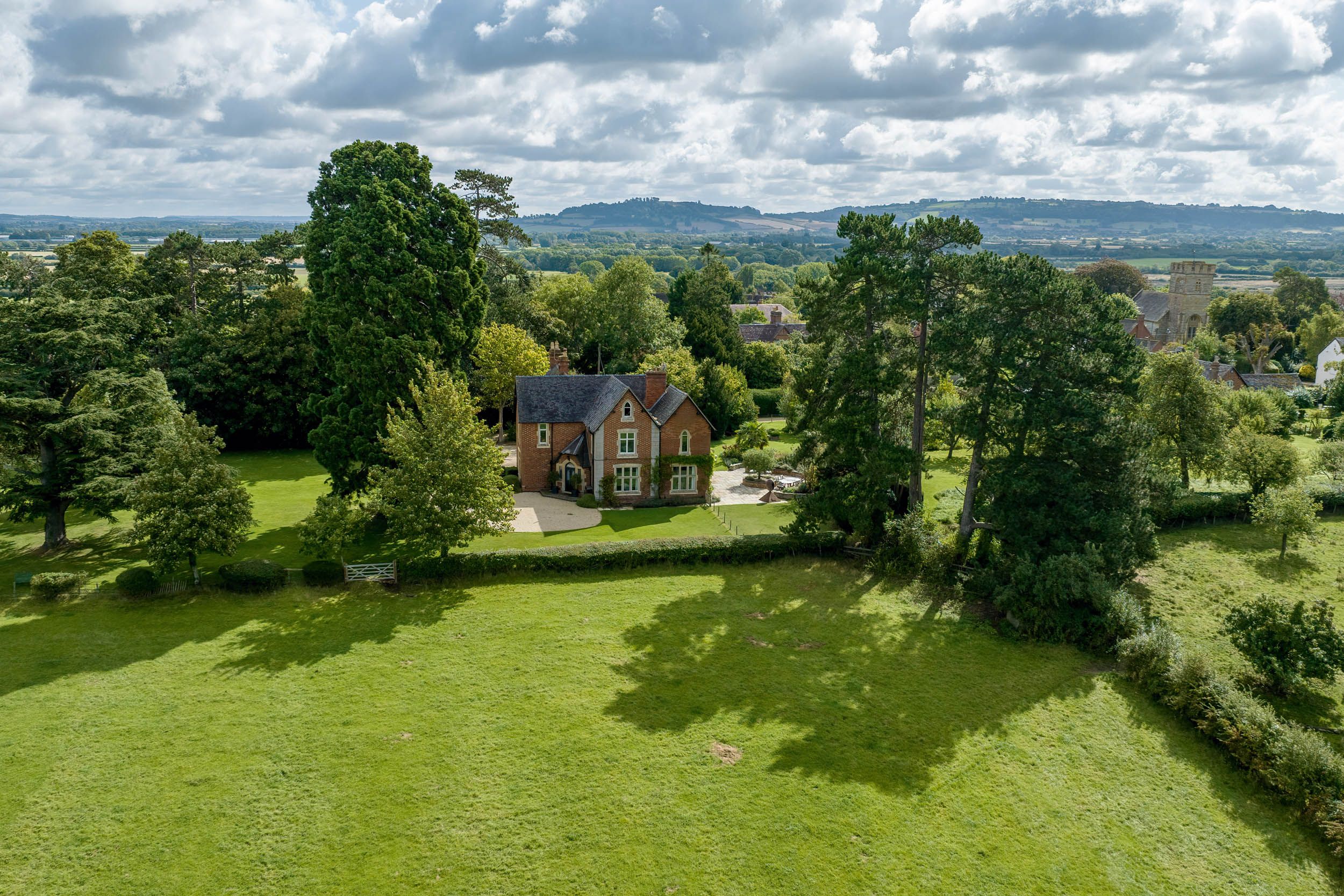 A golden stone manor house in a village that is 'one of the best-kept ...
