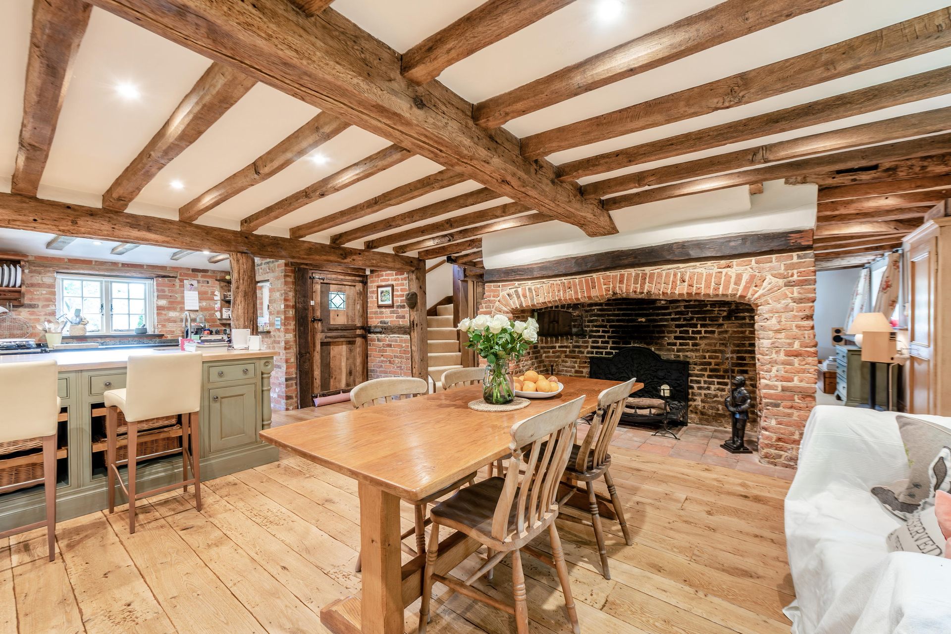 A billionaire's thatched cottage is for sale in Surrey, once owned by ...