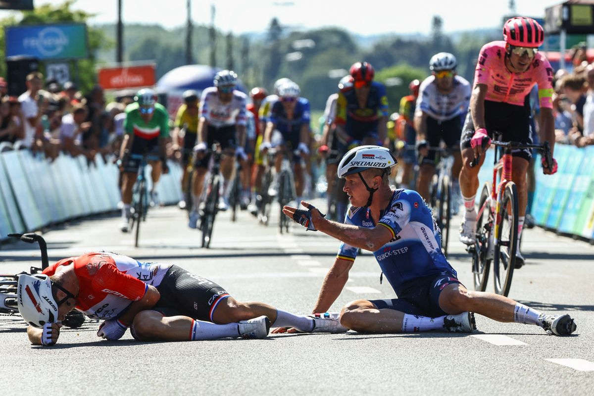 Renewi Tour: Jonathan Milan holds off Philipsen to win messy stage 1 ...