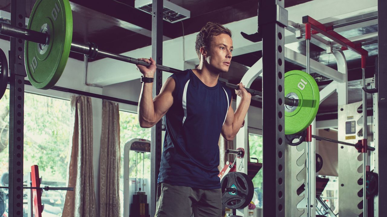 How to do a barbell squat: expert tips and variations to try at home ...
