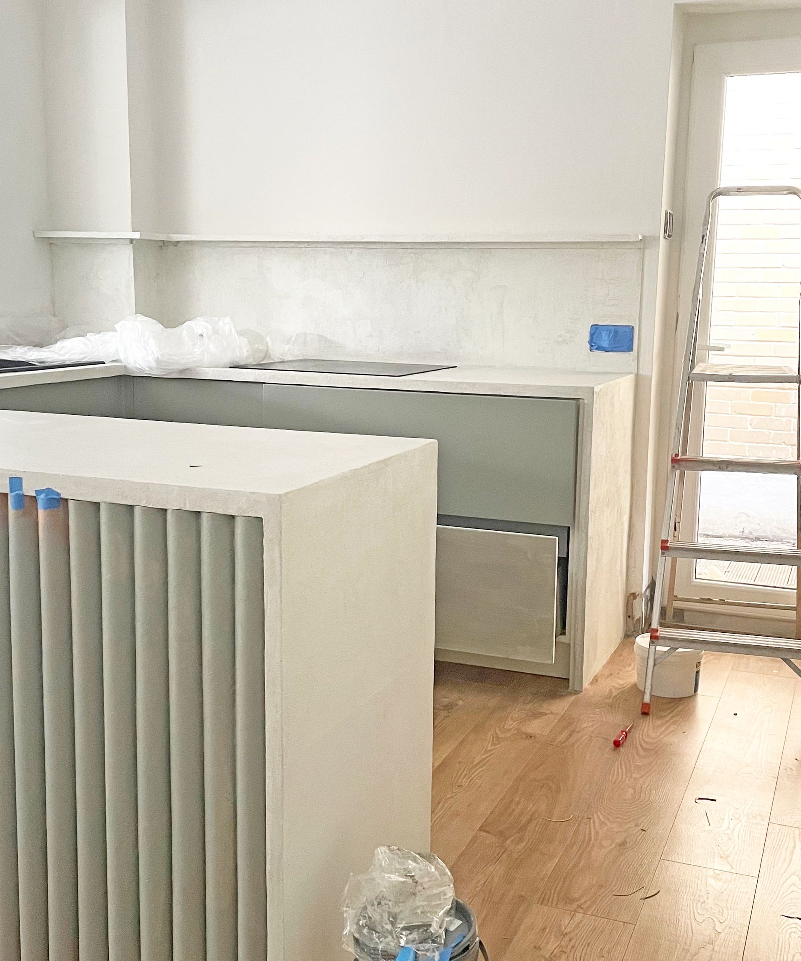 How to DIY a microcement backsplash for a cool, budget kitchen upgrade ...