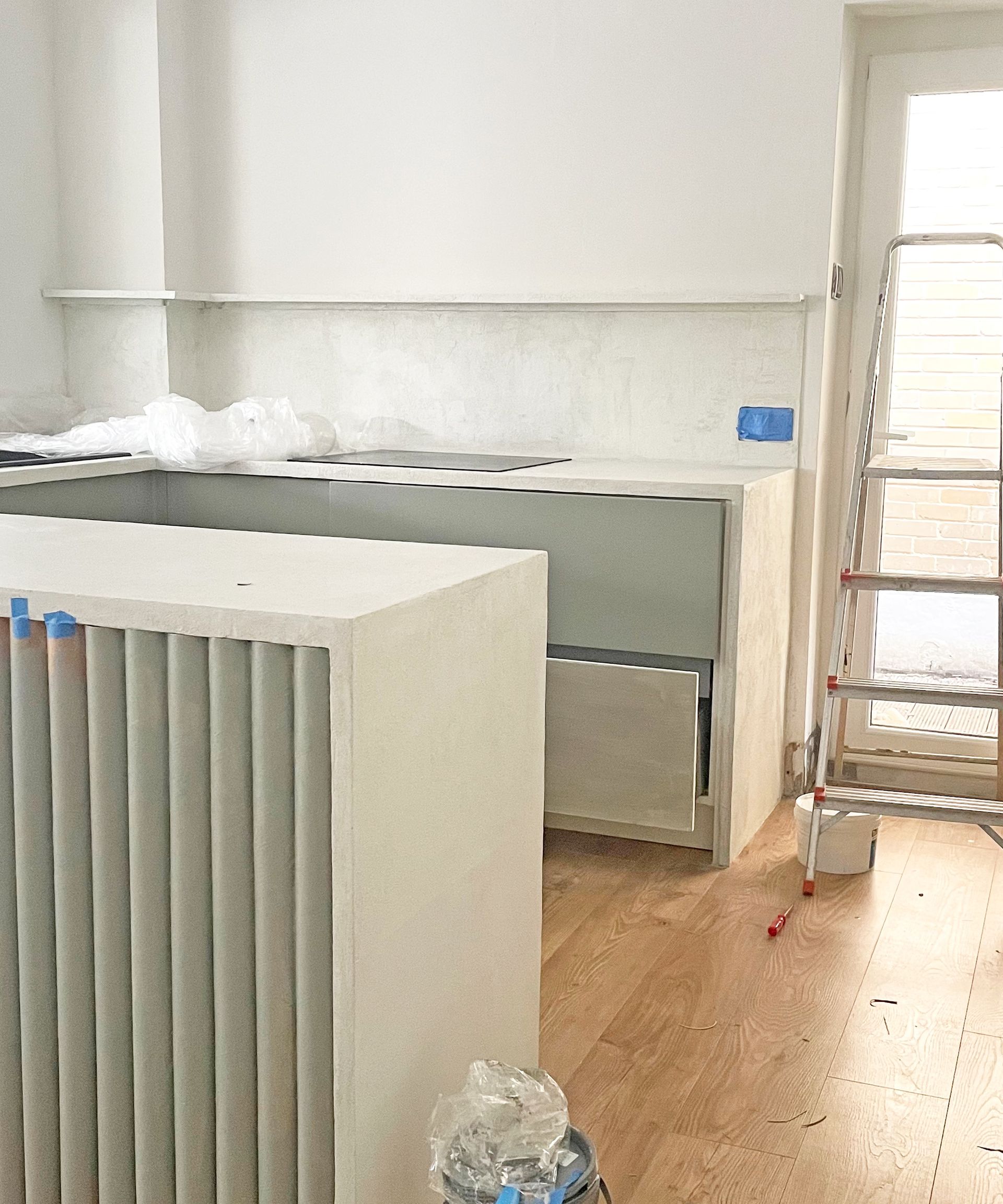 How to DIY a microcement backsplash for a cool, budget kitchen upgrade ...