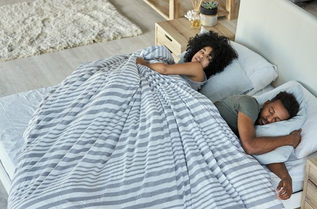 A third of British couples share a bed with a ‘blanket bandit’ | Woman ...