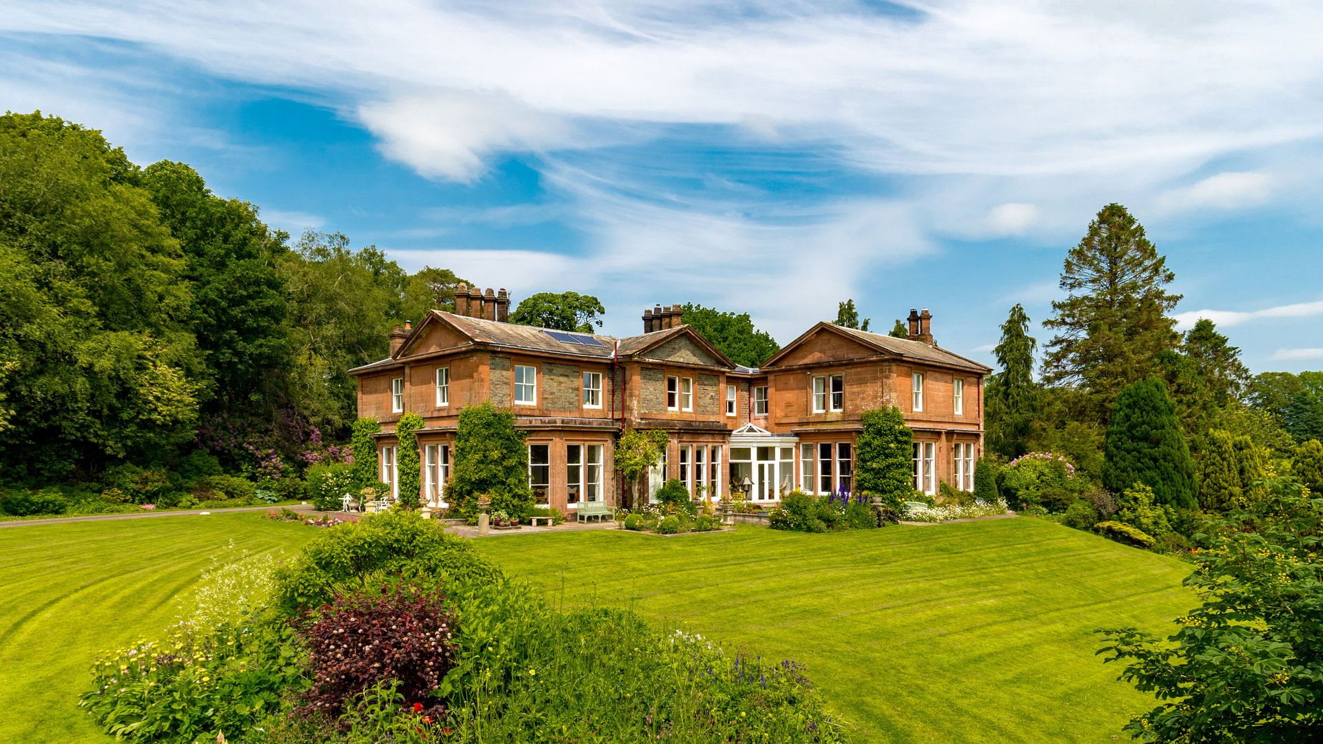 A grand seven-bedroom manor house with 11 acres, stables, 600 metres of ...