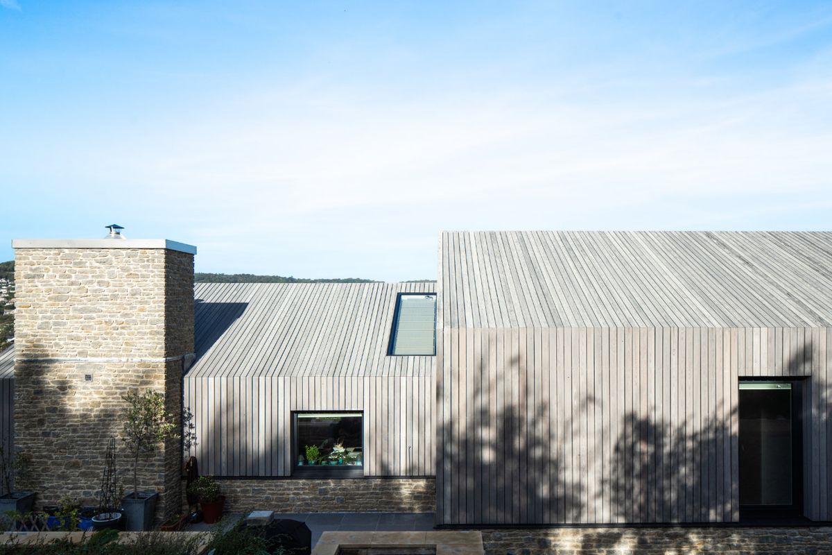 This sustainable modern barn blends into the landscape to maximise its ...