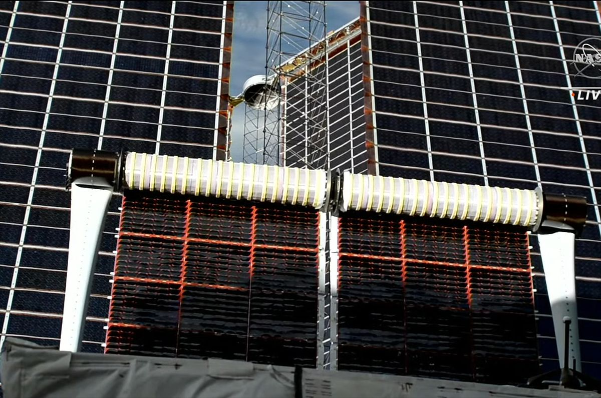 NASA astronauts unfurl 4th solar array outside space station | Space