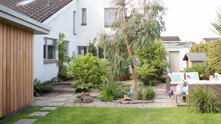 When to scarify a lawn for healthier and greener grass | Ideal Home