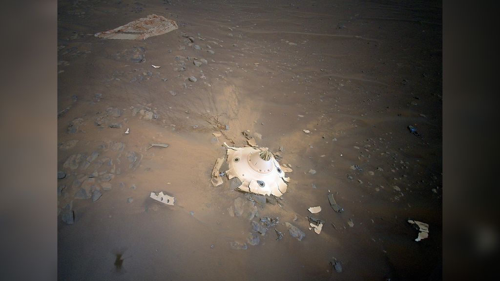 Mars helicopter photographs wreckage of its own landing gear in eerily ...