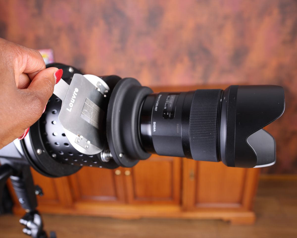 Emulate film noir lighting in a home photography setup, using a gobo ...