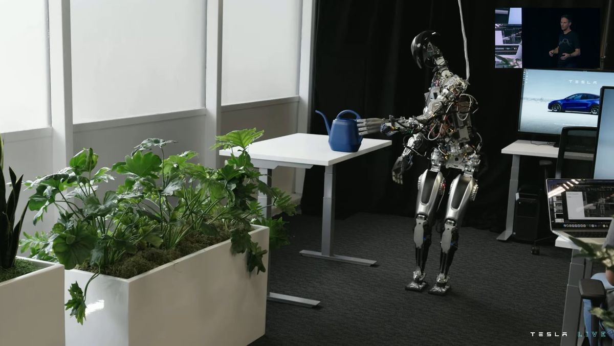 Elon Musk demos the human-like Optimus Tesla Bot — and it walks on its ...