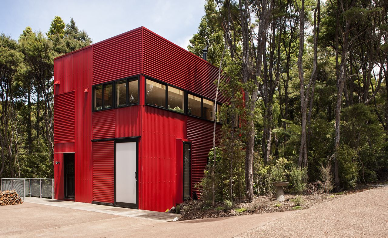 Colour pop: this bright red New Zealand house stands out in its leafy ...