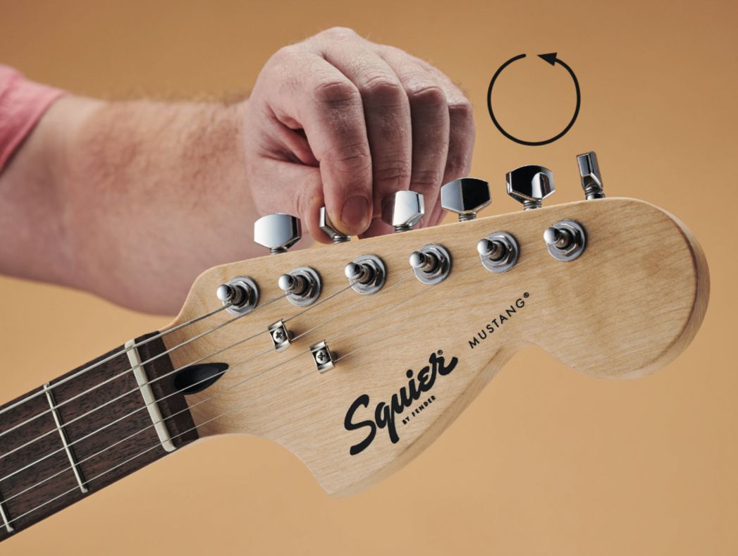 How to tune an electric guitar with a tuner | Guitar World