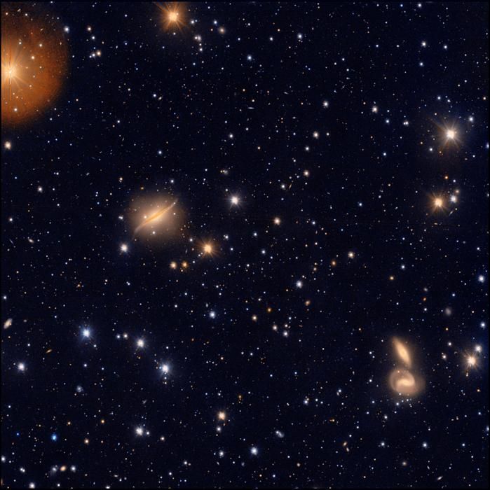 World's largest visible light telescope spies a galaxy cluster warping ...