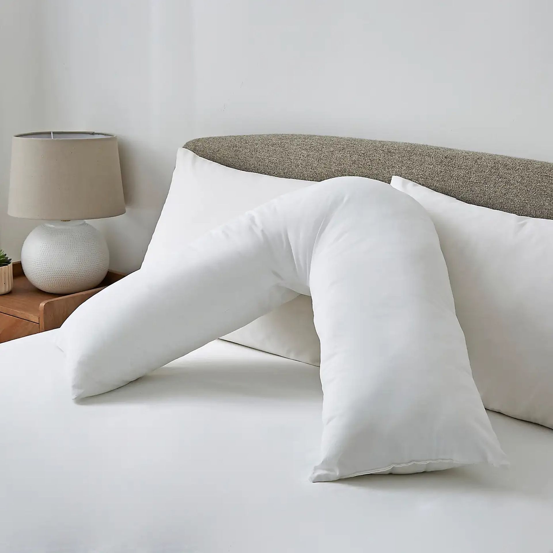 Do you need to swap to a V-shaped pillow? Experts reveal all | Ideal Home