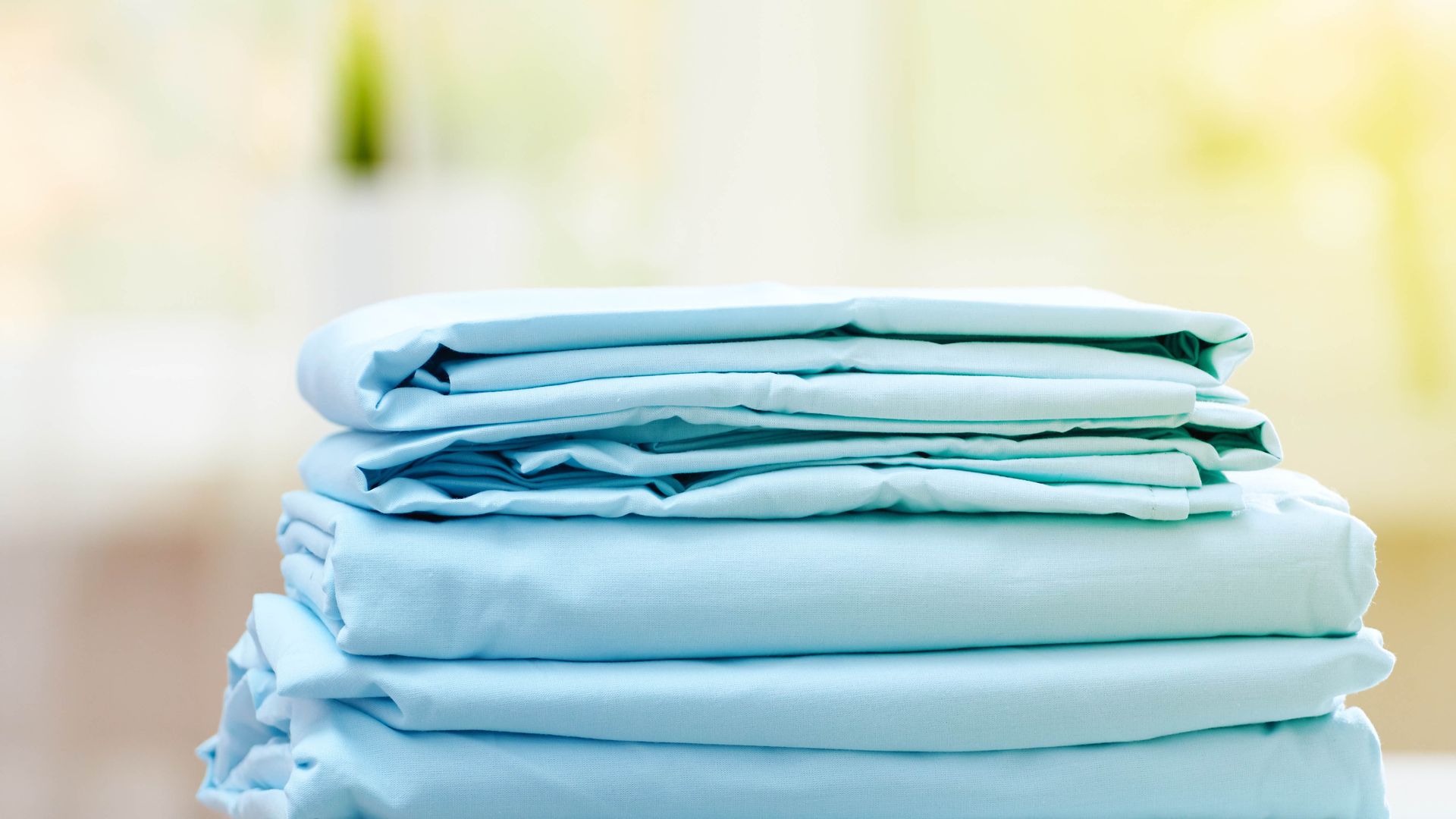 How to fold a fitted sheet in less than a minute | Tom's Guide