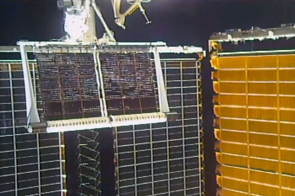Spacewalking astronauts deploy second new solar array for space station ...
