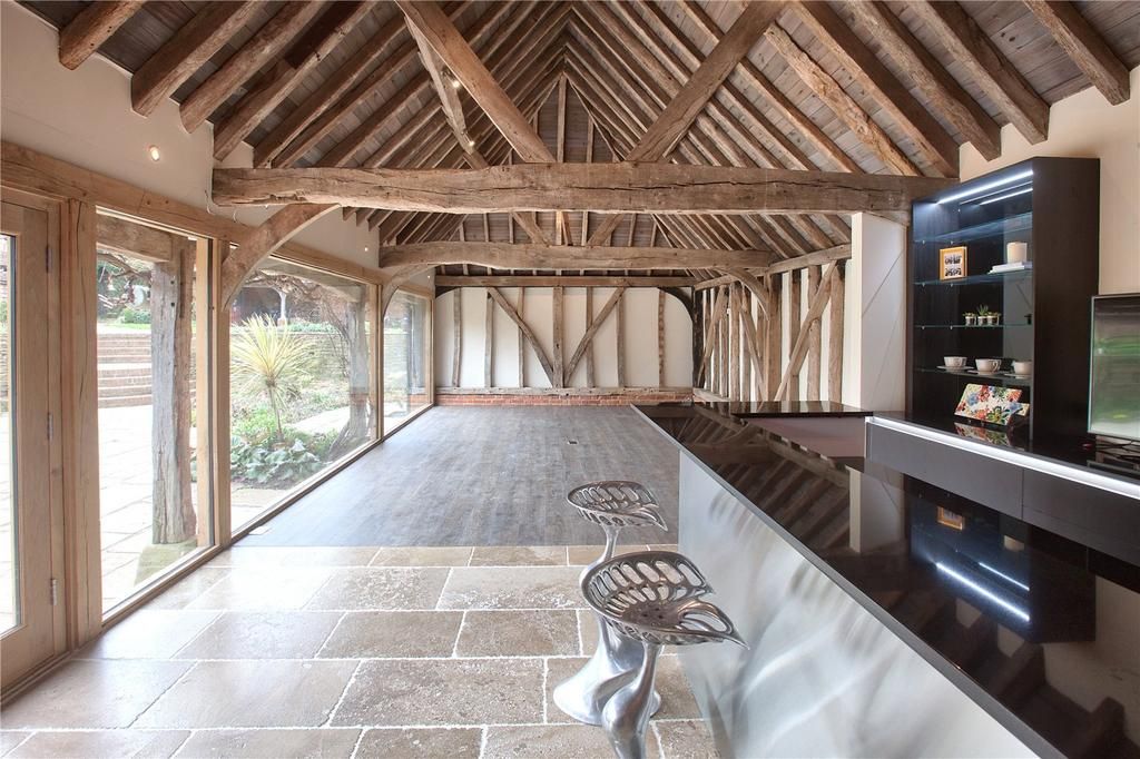 An £18 million Surrey mansion, with vaulted hall, turrets, and a ...